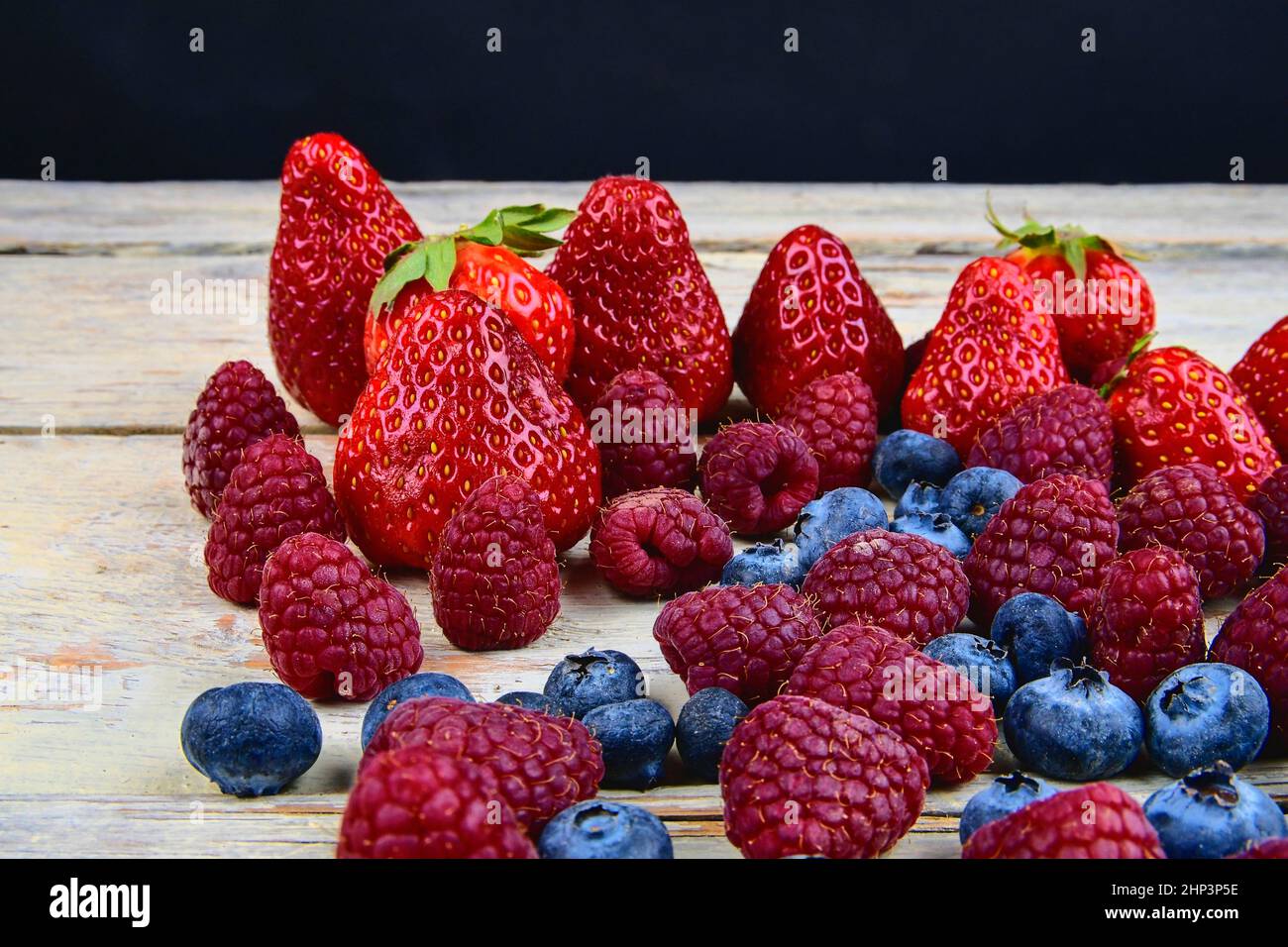 Healthy mixed fruit and ingredients with strawberry, raspberry ...
