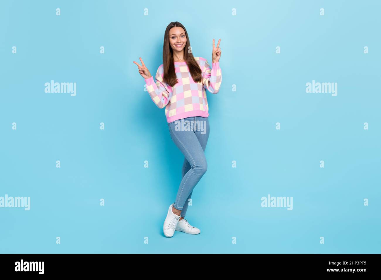 Photo of cheerful friendly lady show two v-signs wear sweater jeans ...