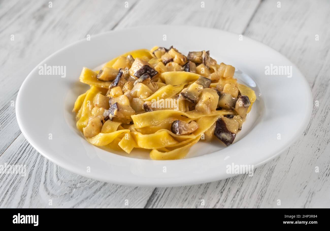 Creamy garlic eggplant and parmesan tagliatelli pasta Stock Photo - Alamy