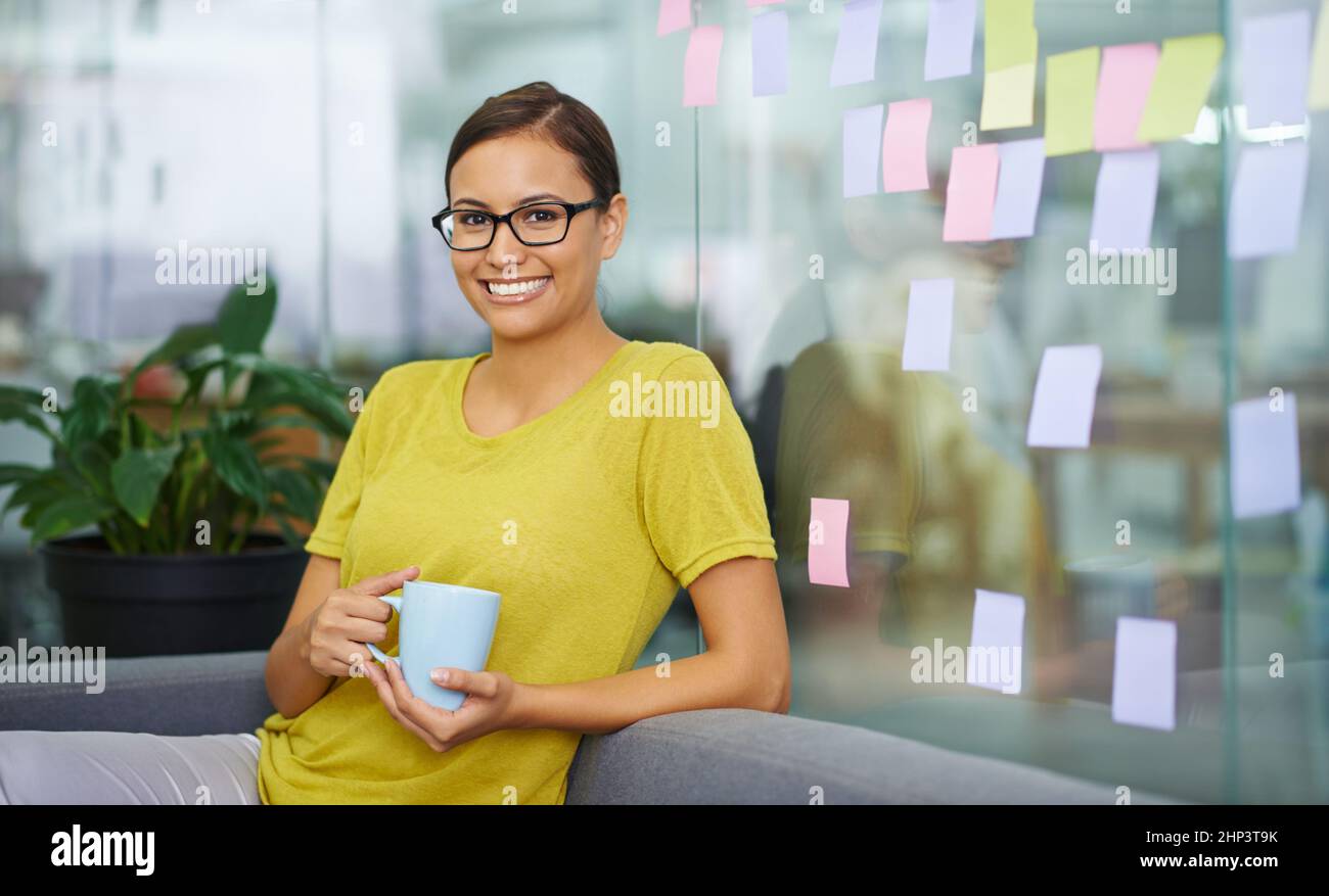 Im having a sneaky second cup. Attractive female office worker sneaking ...