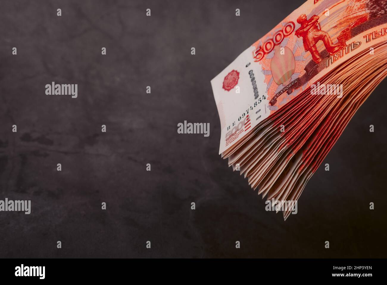 Russian rubles a large bundle on a gray background. A bundle of five ...
