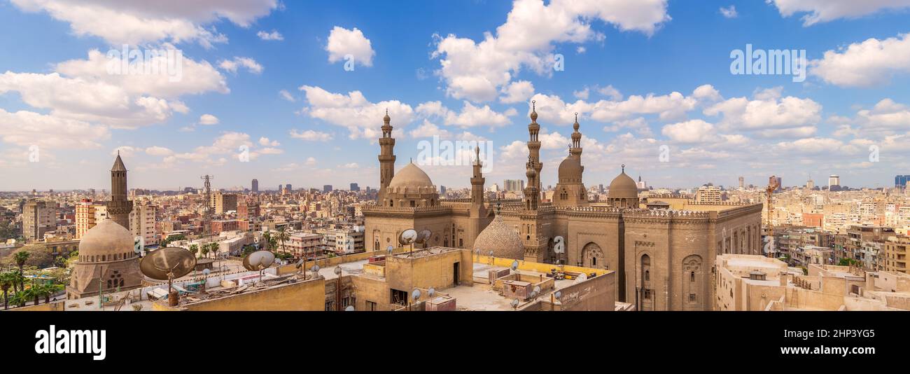 A panoramic shot of minarets and domes of Sultan Hasan Mosque and Al Rifai Mosque in Cairo ...