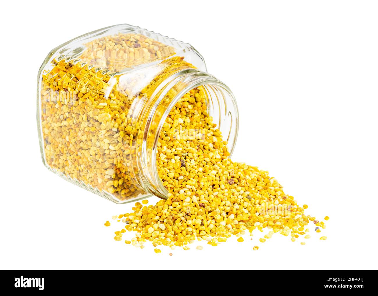overturned glass jar with natural bee pollen isolated on white ...