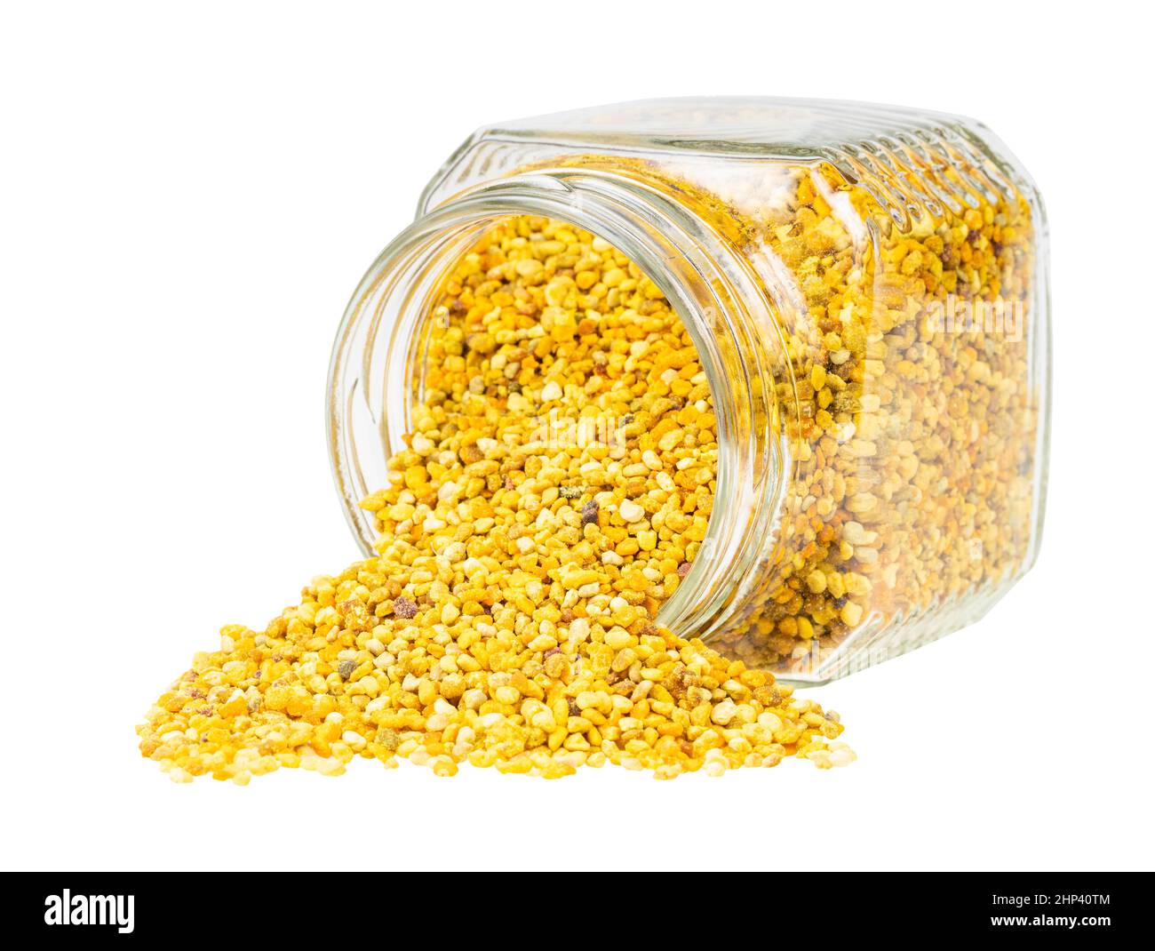 natural bee pollen spilled from overturned glass jar isolated on white ...