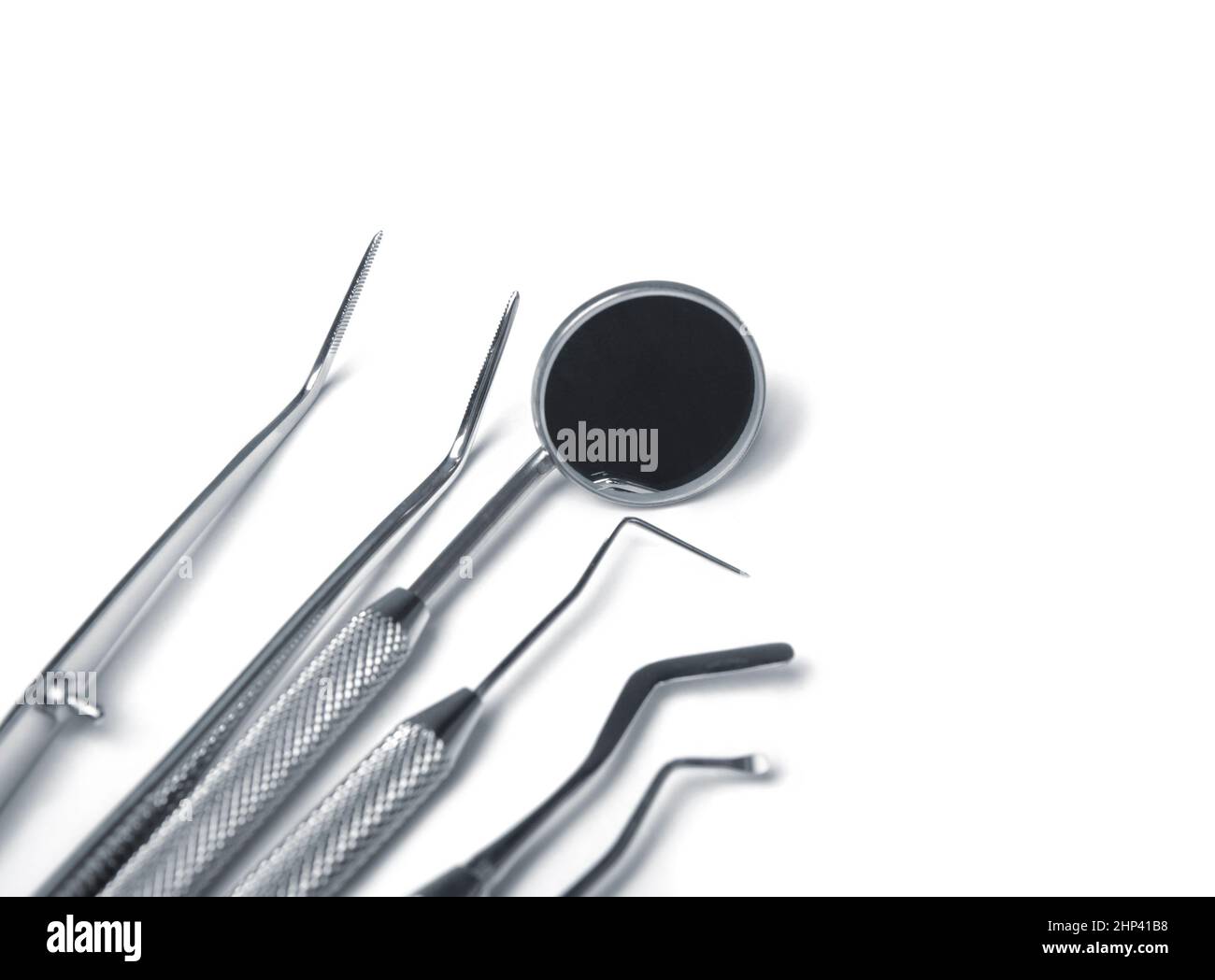 Dental instruments closeup isolated over white Stock Photo - Alamy