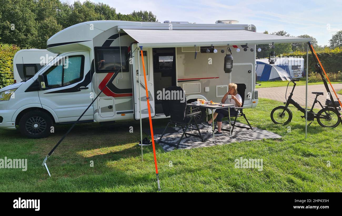 A new mobile home with awning and table and chairs Stock Photo - Alamy