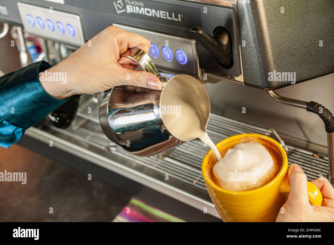 shot of a Barista frothing a Cappuccino Stock Photo - Alamy