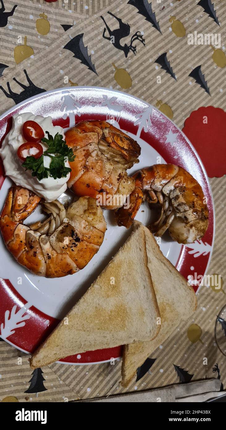 Traditional spanish tapa with prawns cooked in oil with garlic and ...