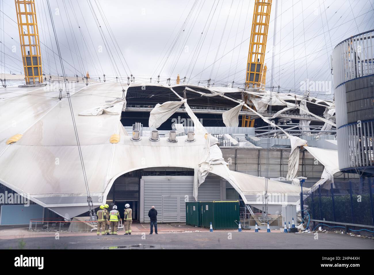 Firefighters inspect damage to the roof of the O2 Arena, in south east ...