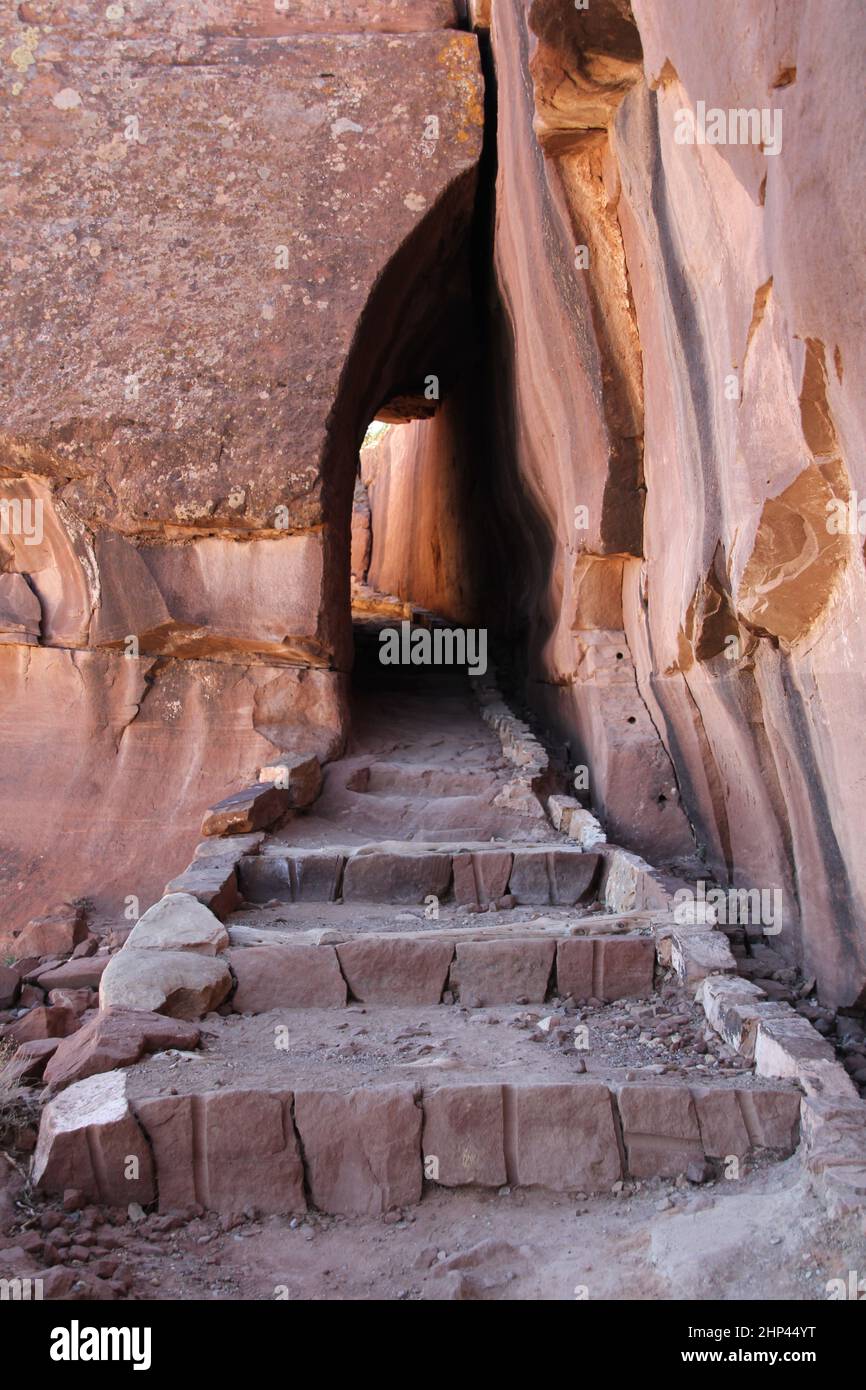 Vertical shot of old stairs leading to a narrow cave Stock Photo - Alamy
