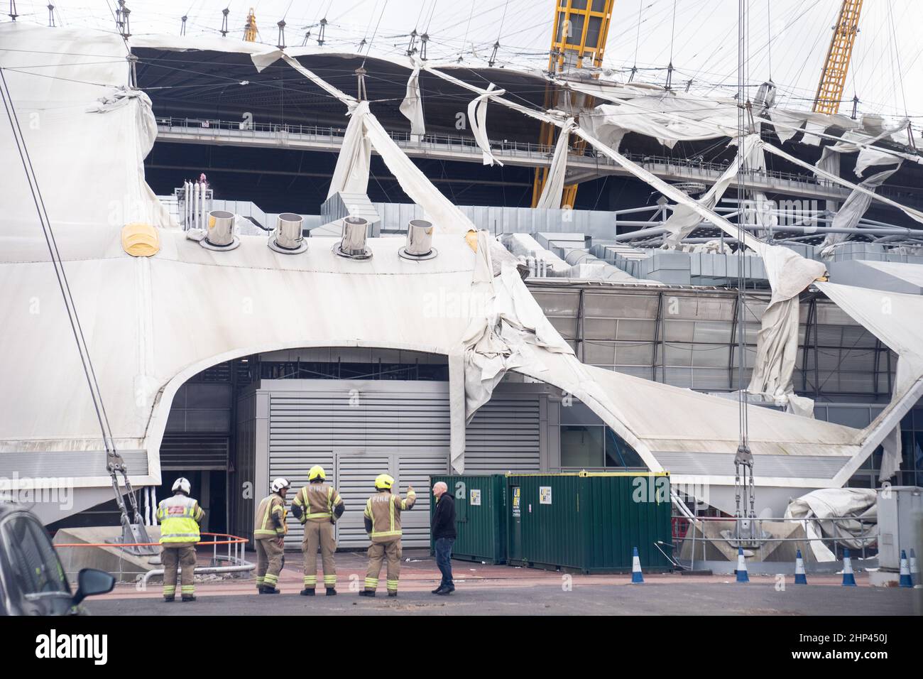 Firefighters inspect damage to the roof of the O2 Arena, in south east ...