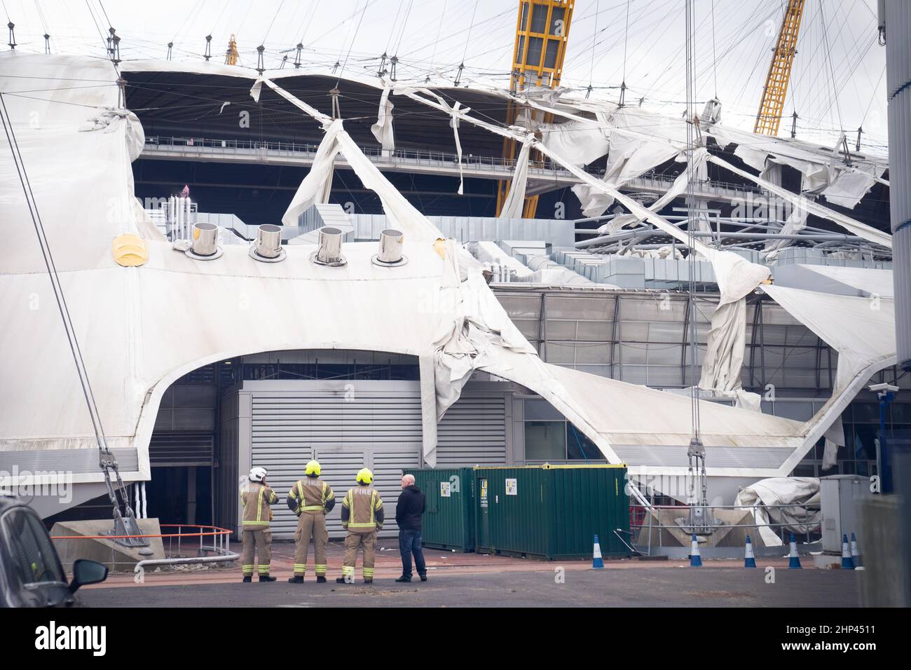 Firefighters inspect damage to the roof of the O2 Arena, in south east ...