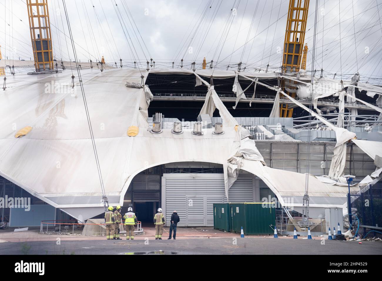 Firefighters inspect damage to the roof of the O2 Arena, in south east ...