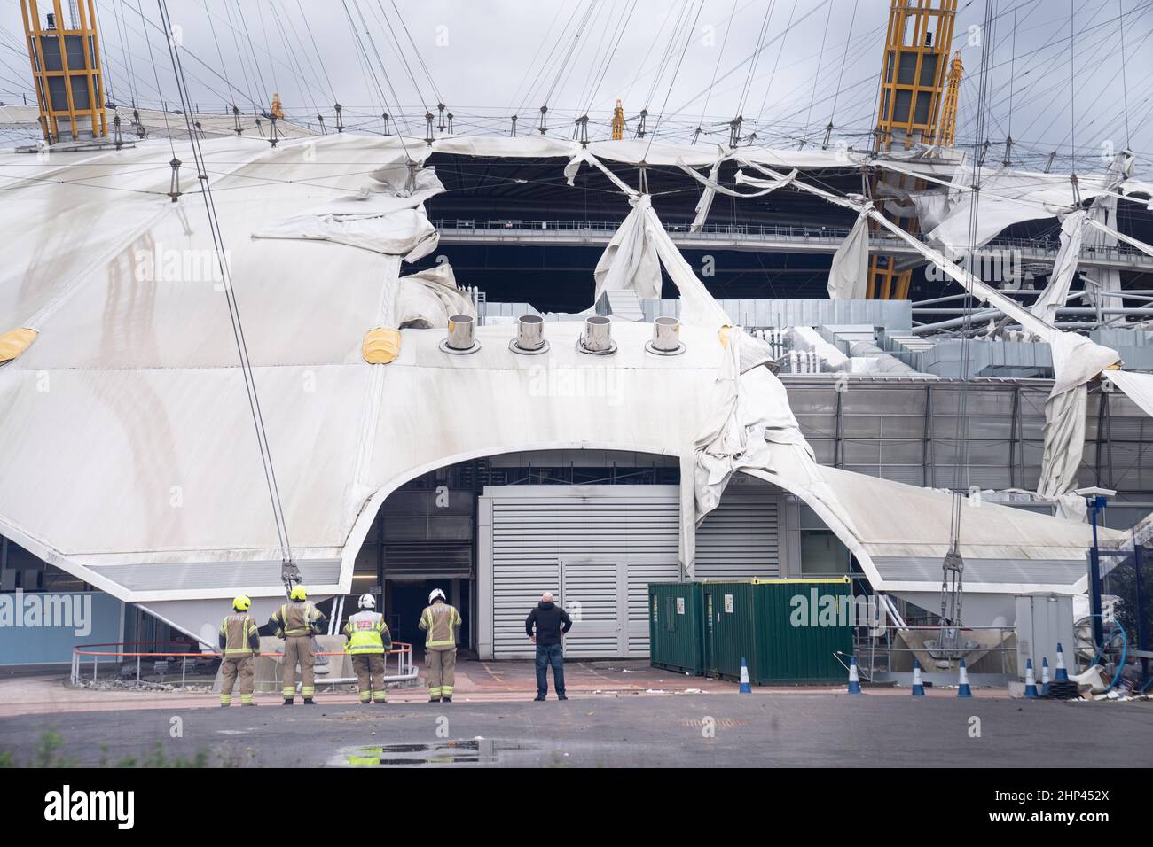 Firefighters inspect damage to the roof of the O2 Arena, in south east ...