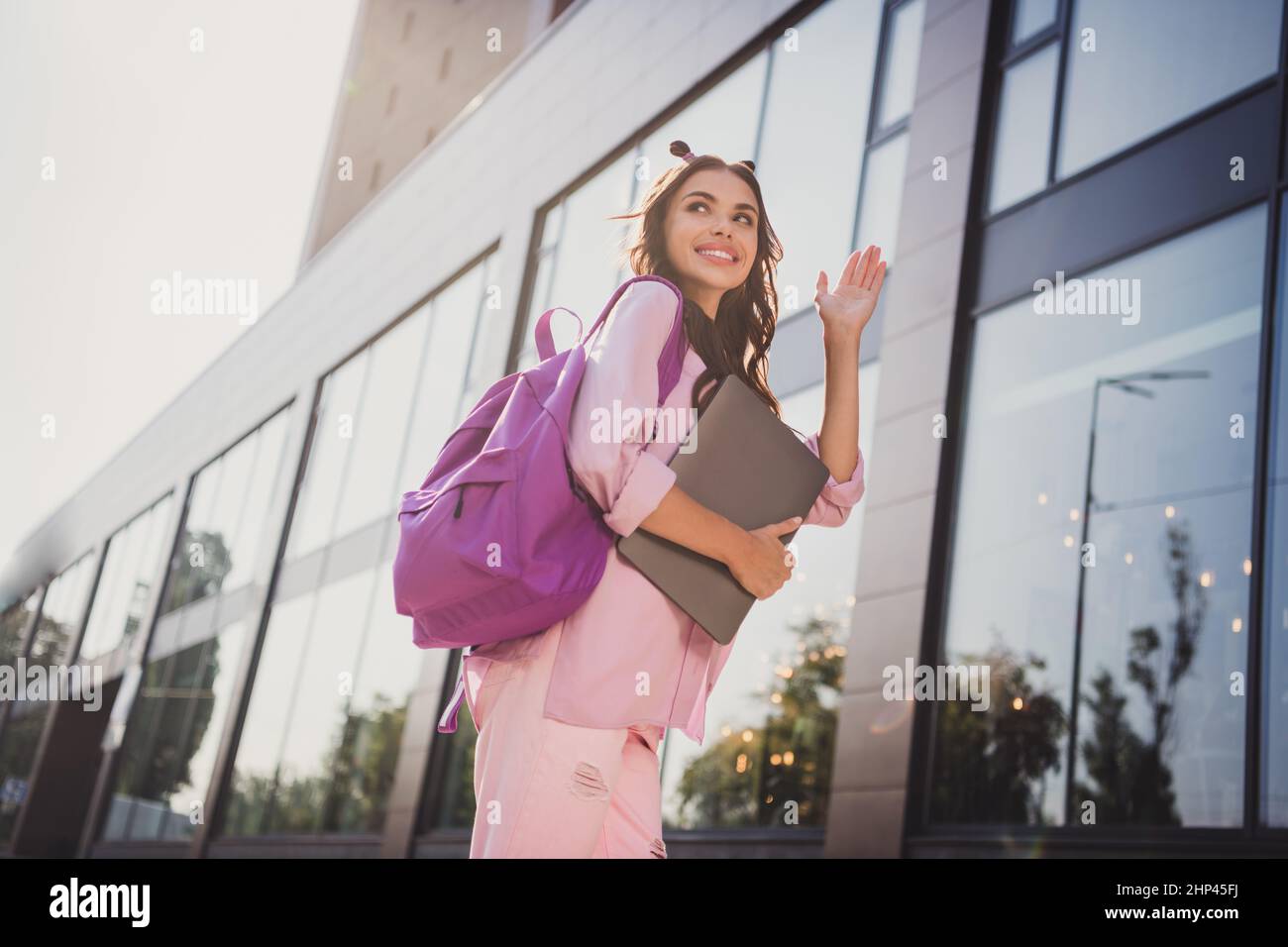 Portrait of attractive cheerful wavy-haired girl spending day time on ...