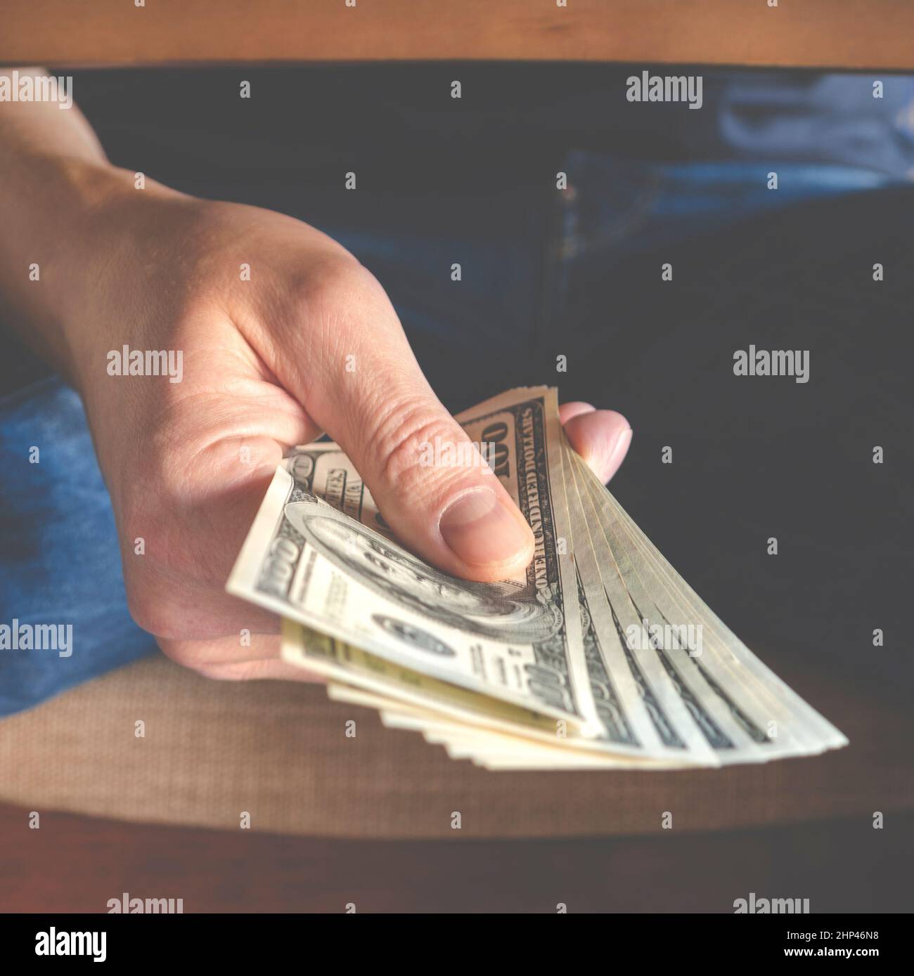 Hands passing money under table corruption bribery, businessman sealing ...