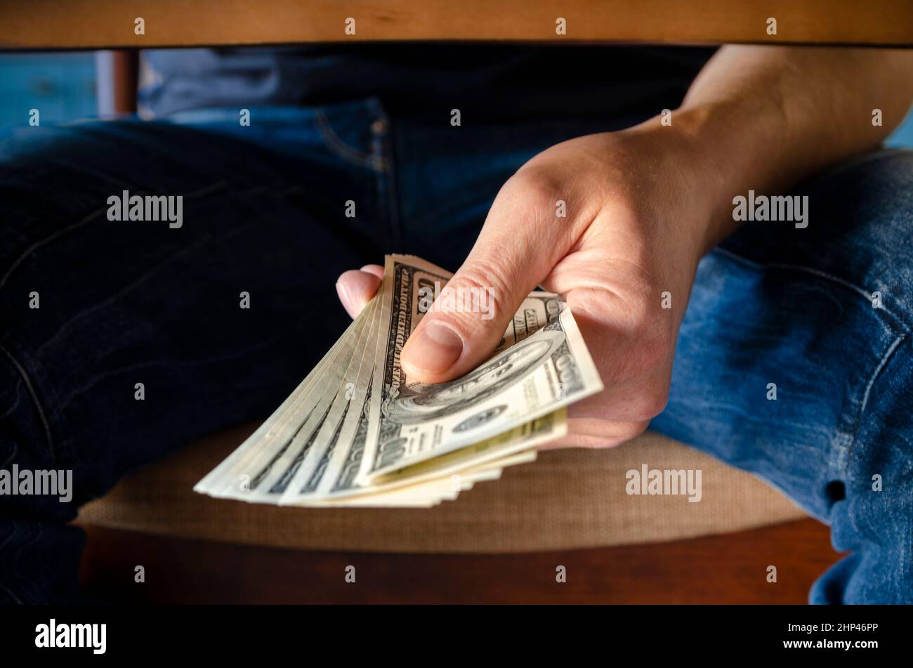 Passing money under the table hi-res stock photography and images - Alamy