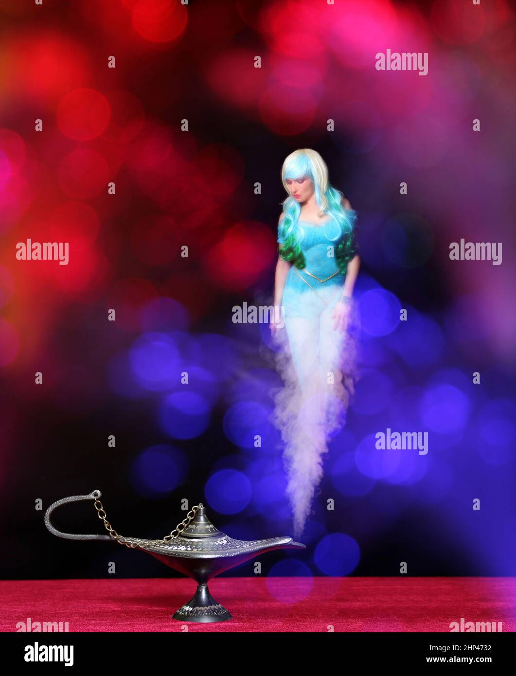 Aladdin's Lamp with Female Genie and Colorful Bokeh Stock Photo - Alamy