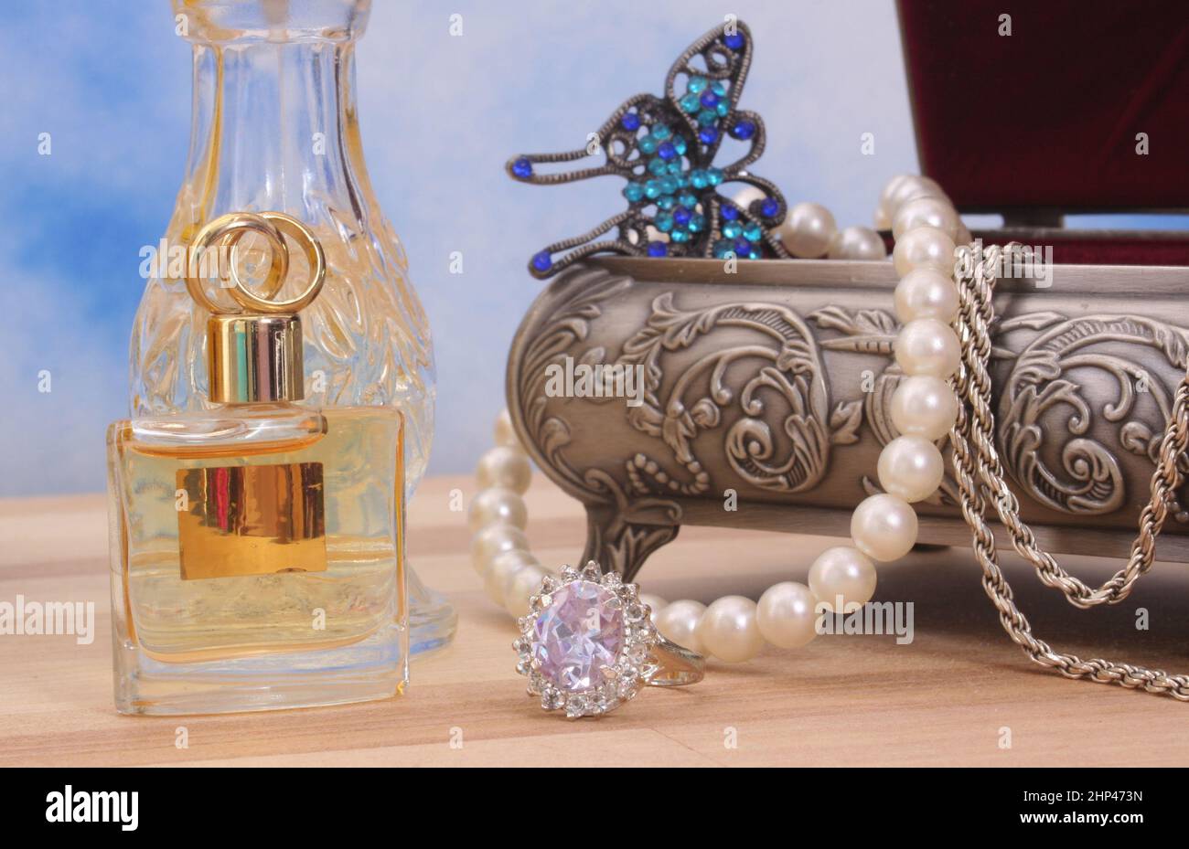 Ring With Flowers and Jewelry Box and Perfume Stock Photo - Alamy