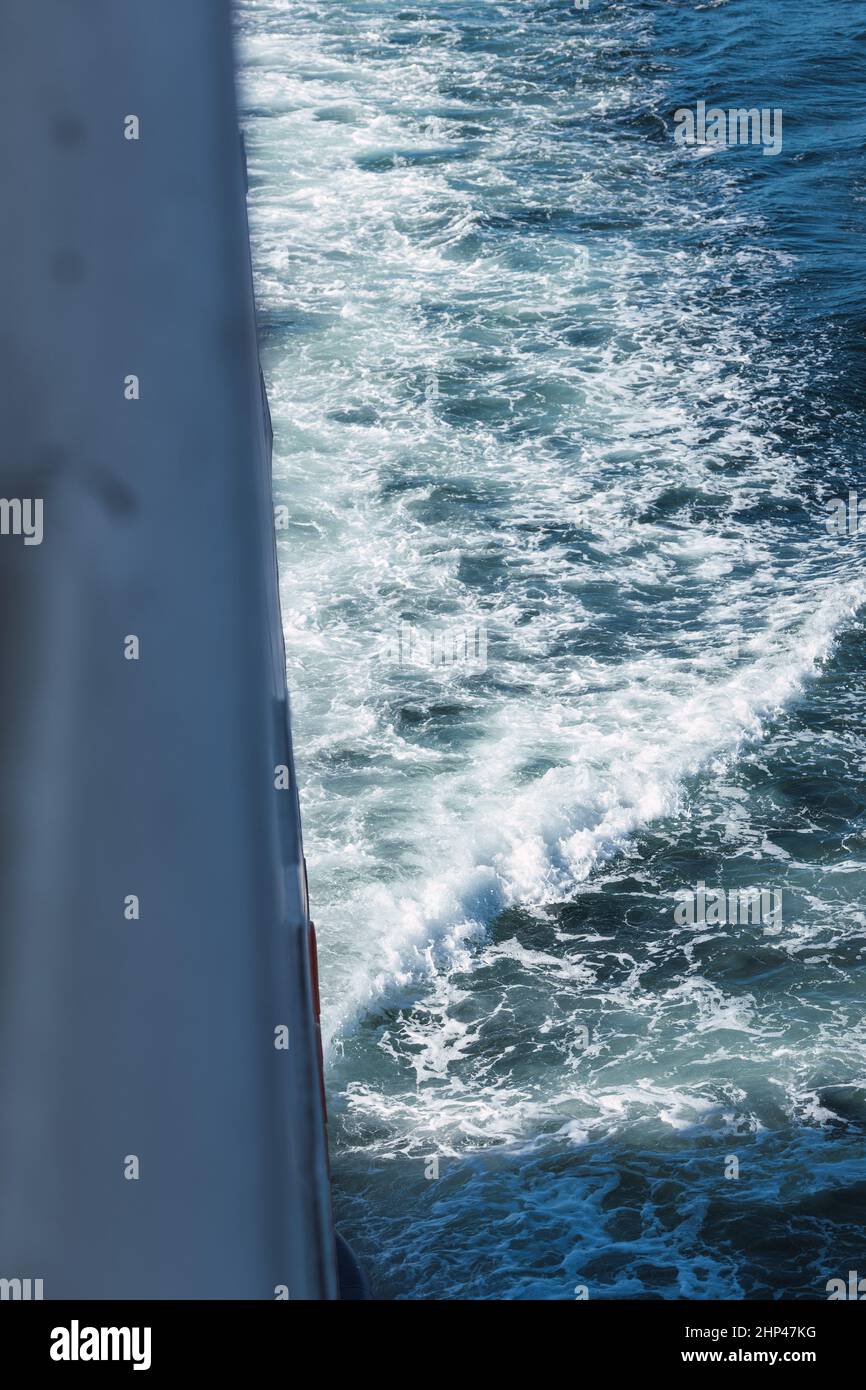 Lateral view of a wake water splash from a ferry boat in the chilean ...