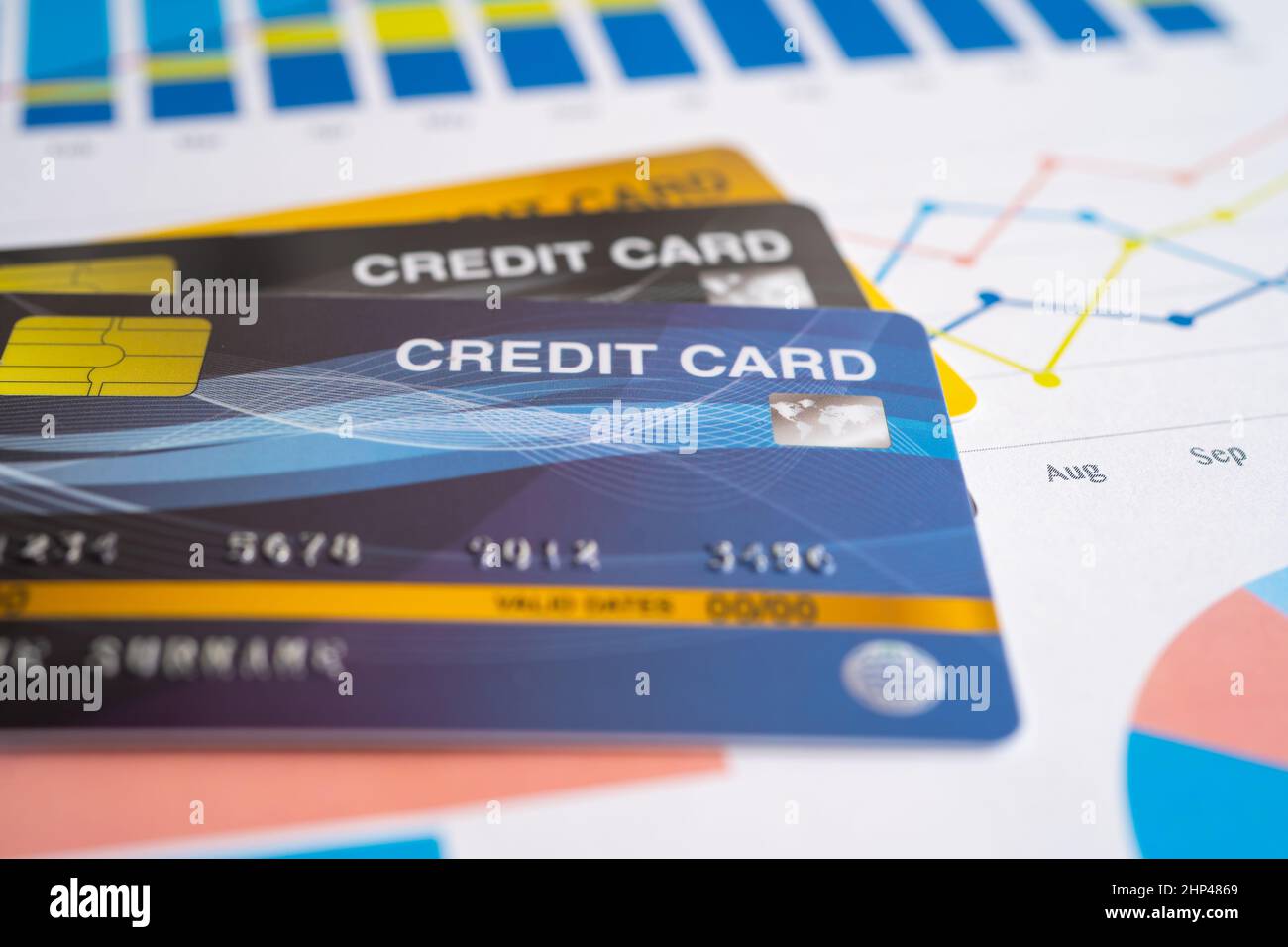 Credit card on chart and graph paper. Finance development, Banking ...