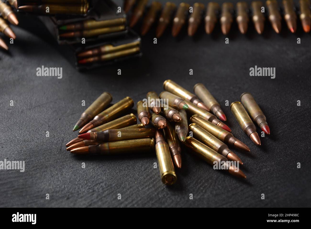 Photo of 5.56mm NATO Ammunition, machine gun bullets belt, rifle ...