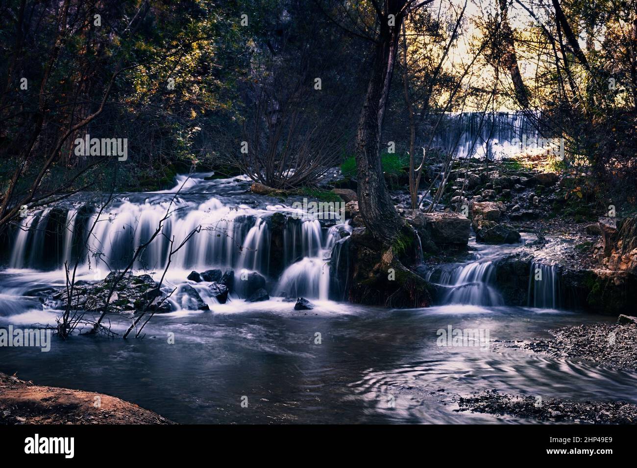 Group of small waterfalls in the autumn forest. Long exposure ...