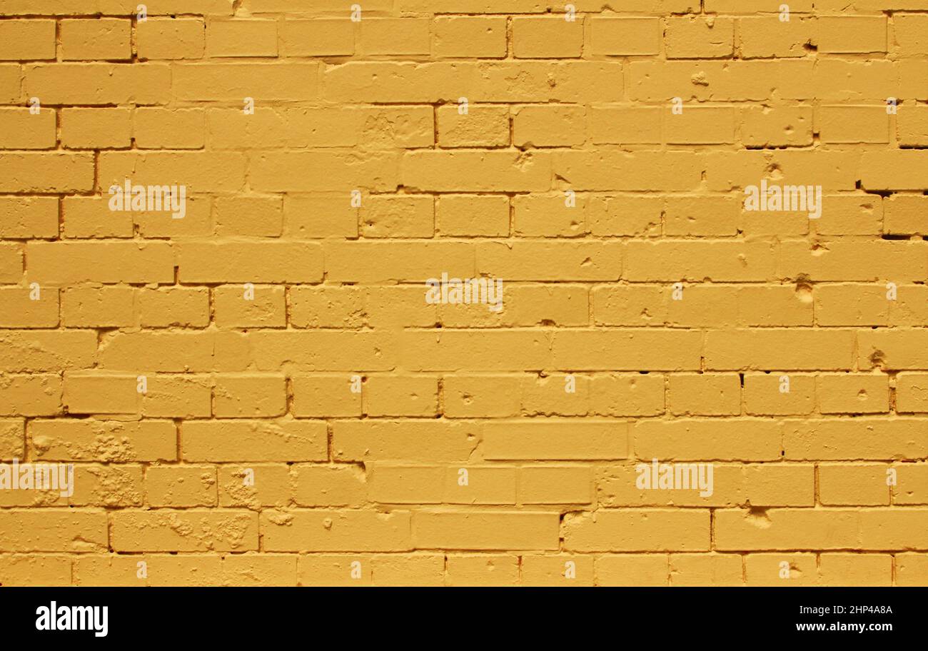 Background pattern texture made from a bright yellow brick wall Stock ...
