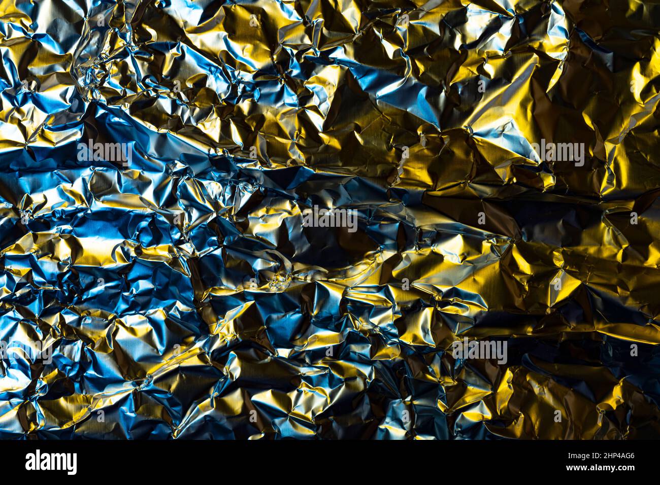 crumpled foil background illuminated with colored lights Stock Photo ...