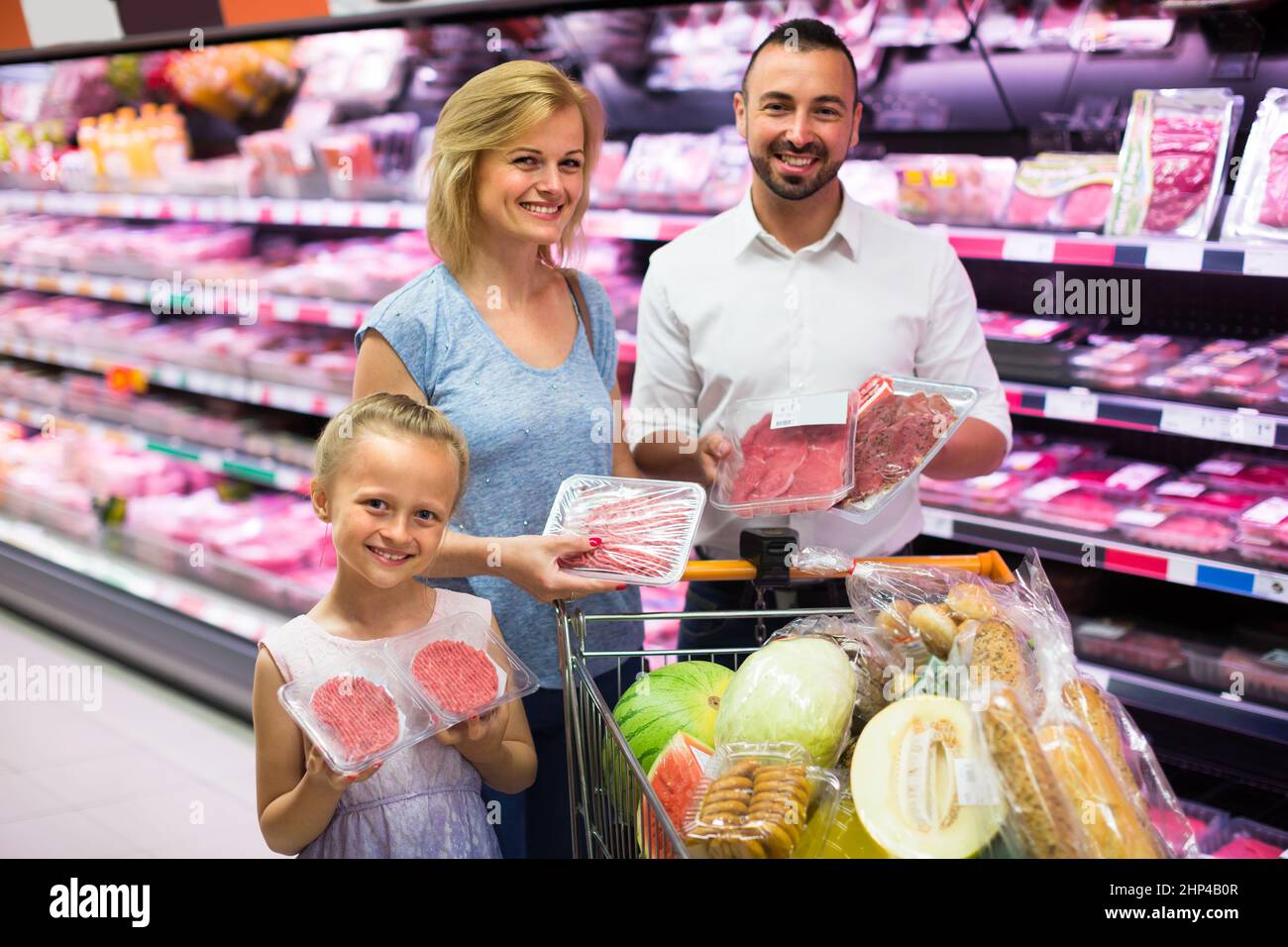 Family buying meat in supermarket Stock Photo - Alamy
