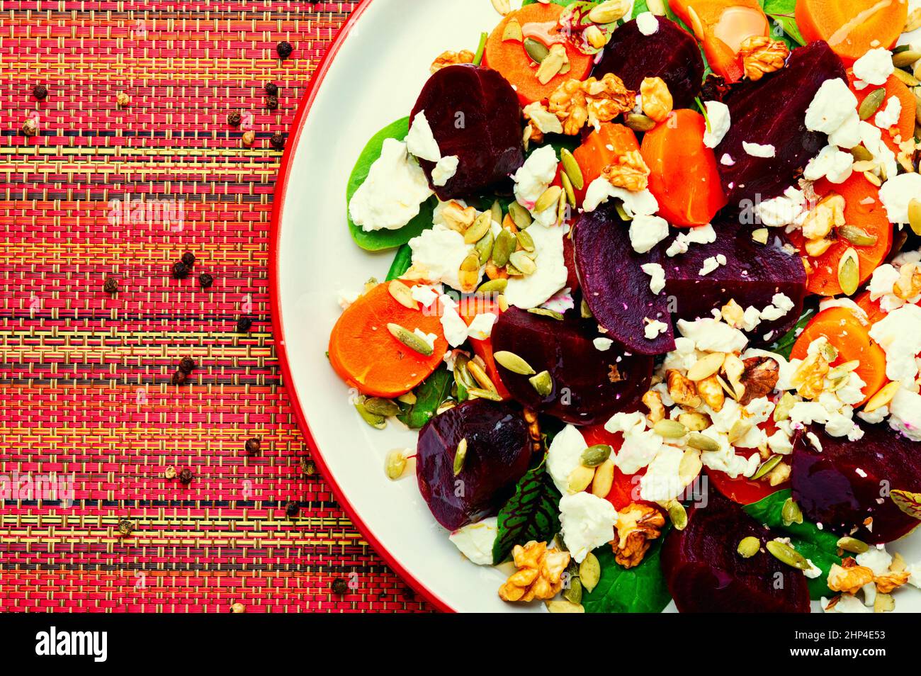 Diet salad with beetroot, carrots, cottage cheese, herbs and nuts ...