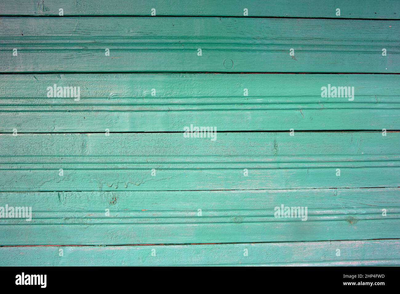 part of the wall is made of boards clapboard painted in green. High ...