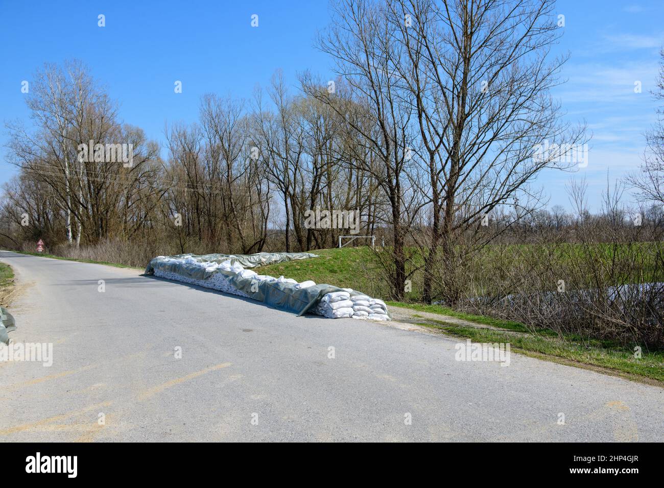 A road is protected with sandbags as flood protection Stock Photo - Alamy