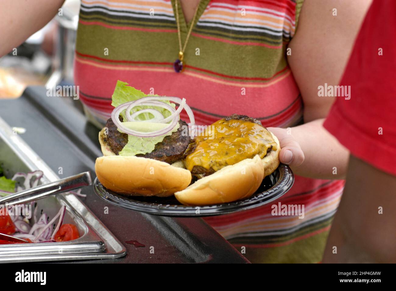 Hamburgers and Hotdogs cooking on Bar-B-Q at Club cookout for kids and ...