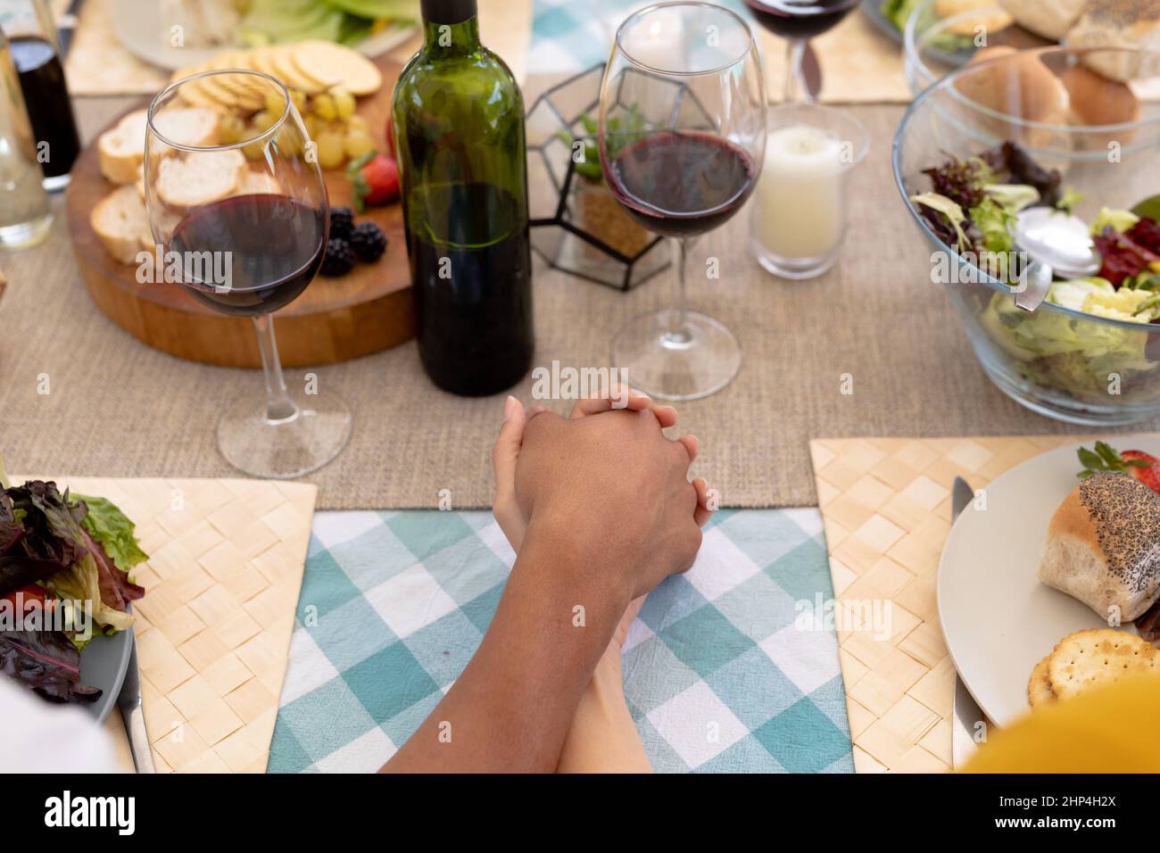 Couple holding hands dinner table hi-res stock photography and images ...