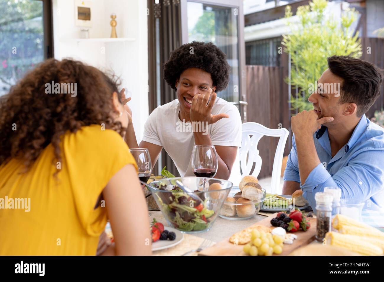 Sitting at dining table hi-res stock photography and images - Alamy