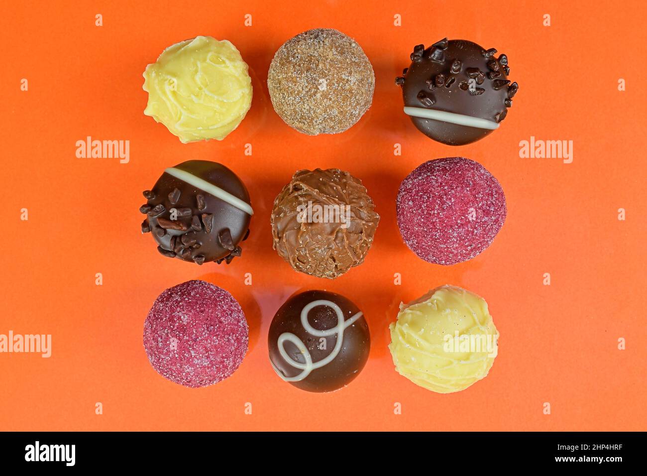 Chocolate pralines top view stock images. Chocolate candies on an ...