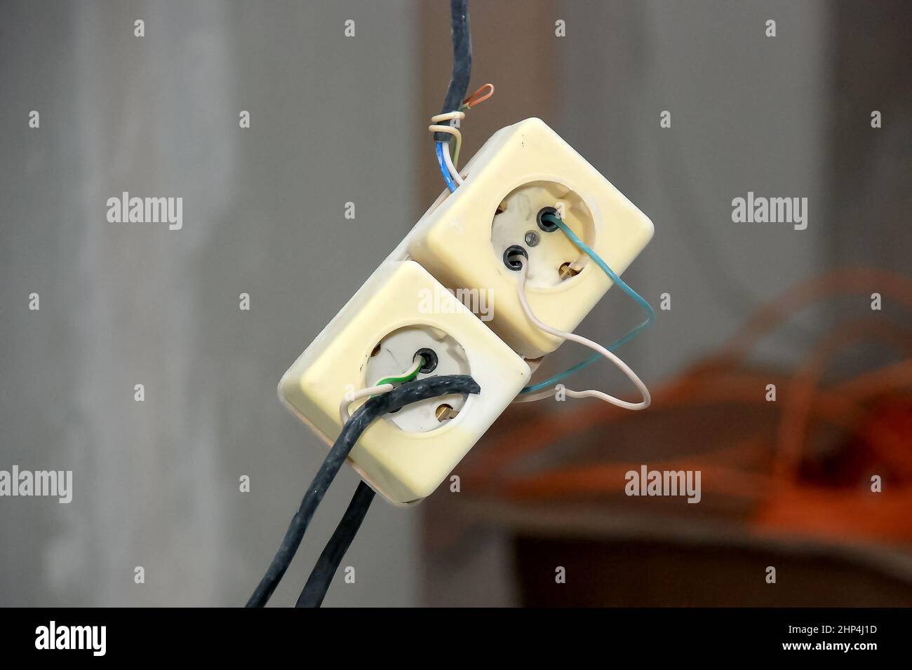 Hanging electrical outlets on wires. High quality photo Stock Photo - Alamy