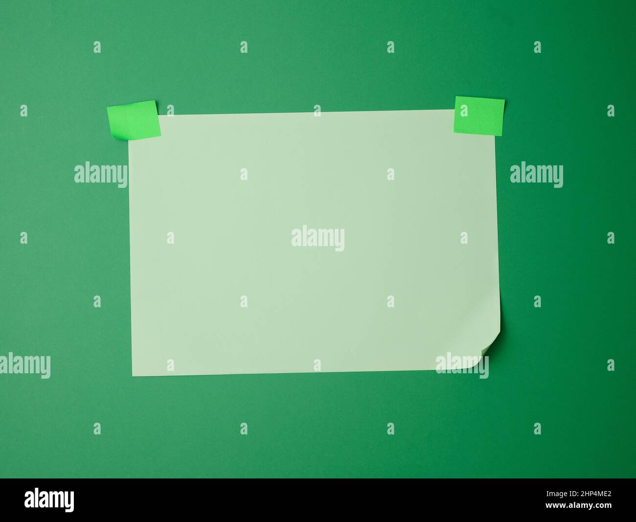 rectangular blank green sheet of paper glued with green sticky paper on ...