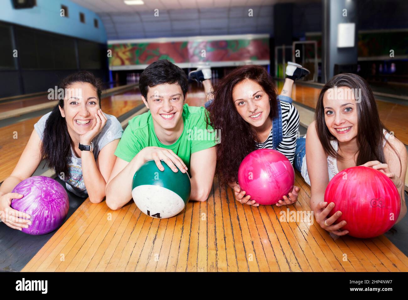 group of friends getting ready to play bowling Stock Photo - Alamy