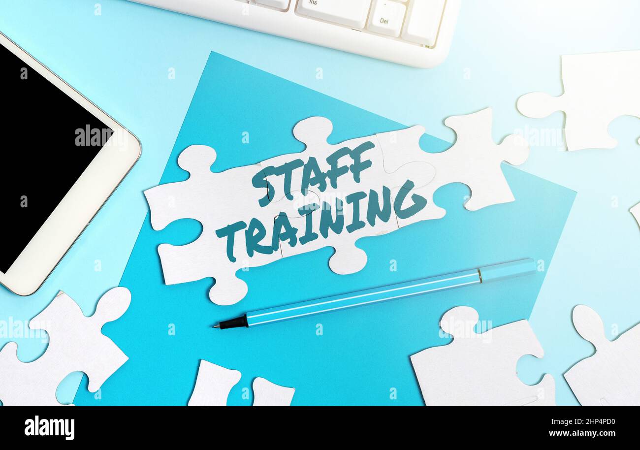 Sign displaying Staff Training, Business overview A program that helps ...