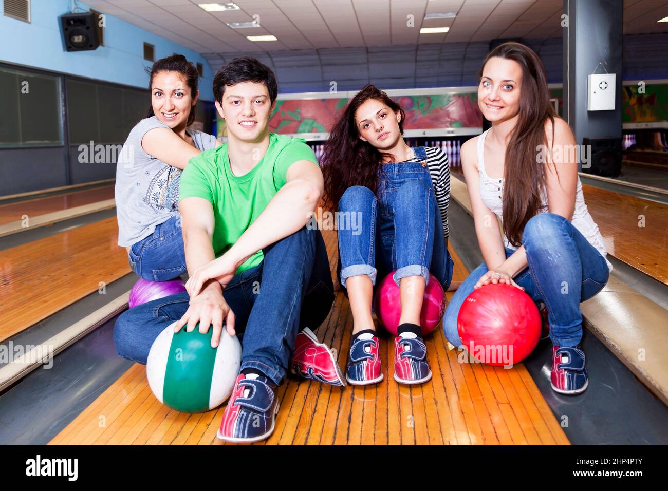 group of friends getting ready to play bowling Stock Photo - Alamy