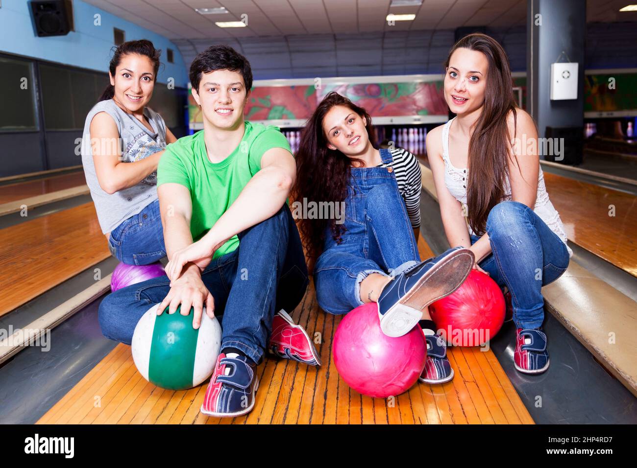 group of friends getting ready to play bowling Stock Photo - Alamy