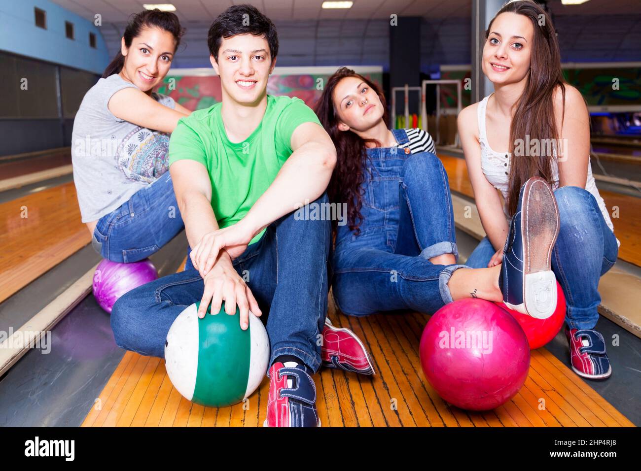 group of friends getting ready to play bowling Stock Photo - Alamy