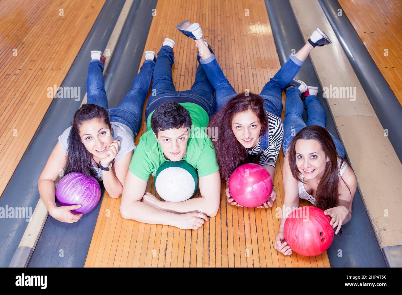 group of friends getting ready to play bowling Stock Photo - Alamy