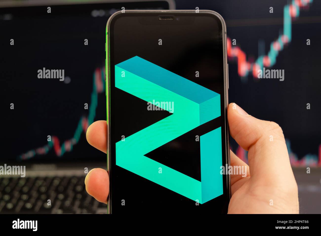 Zilliqa ZIL cryptocurrency logo on the screen of a smartphone in mans ...