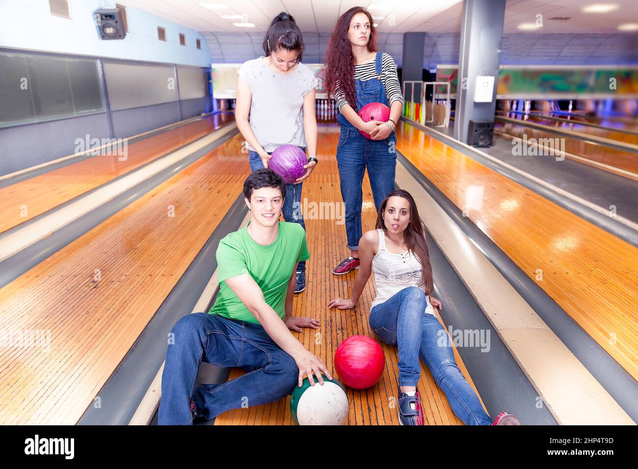 group of friends getting ready to play bowling Stock Photo - Alamy