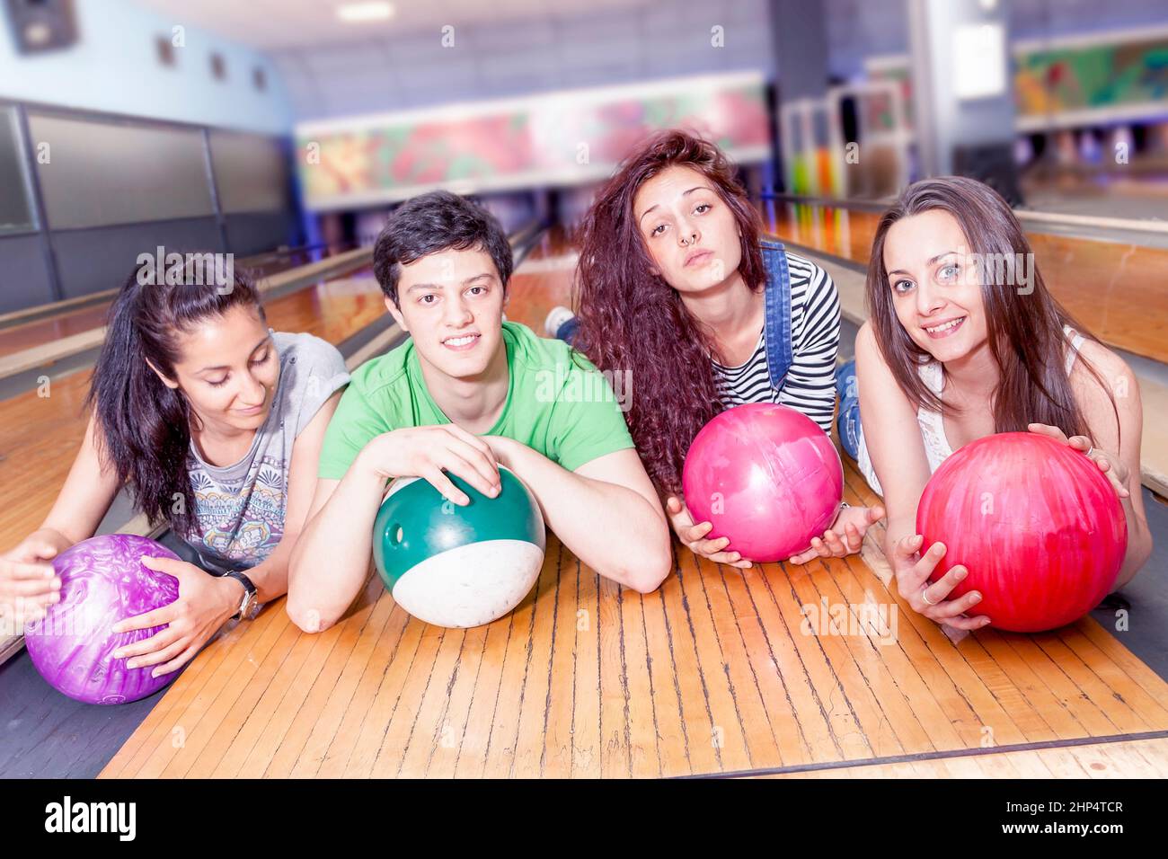 group of friends getting ready to play bowling Stock Photo - Alamy
