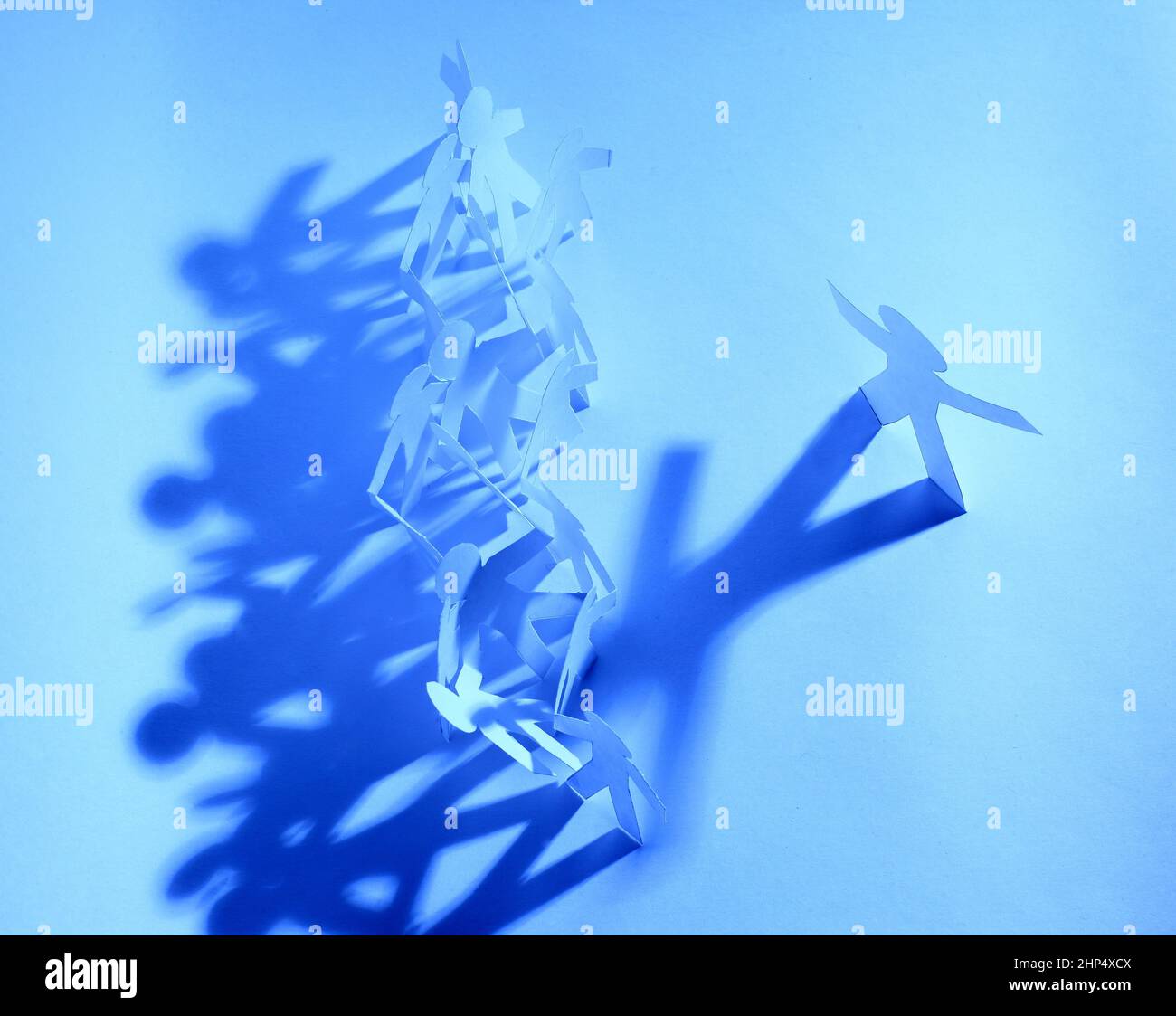 A group paper people holding hands indicating community support ...