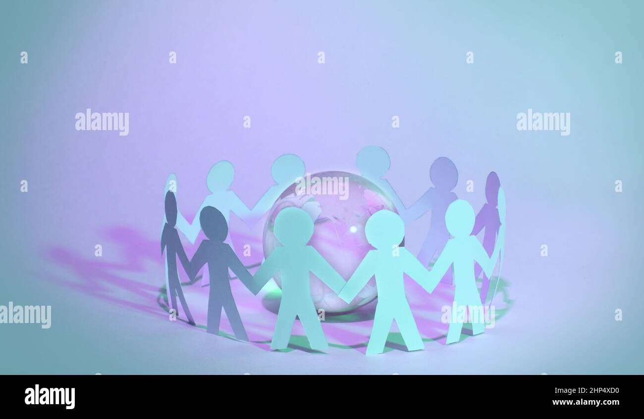 Paper people standing in a circle around glass globe Stock Photo - Alamy